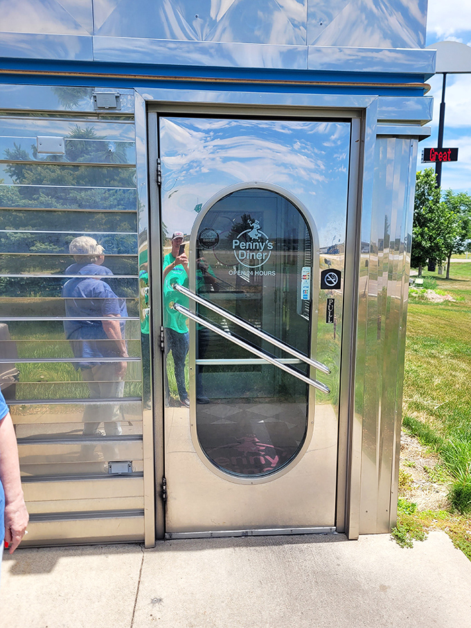 The gateway to gastronomic bliss! Penny's entrance beckons like a shiny, retro portal to a world of comfort food and friendly faces.