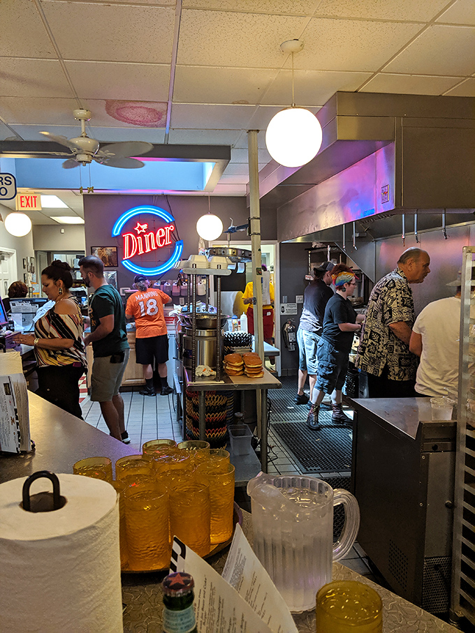 Where the magic happens! The kitchen crew works their burger alchemy, turning simple ingredients into gold medal-worthy creations.