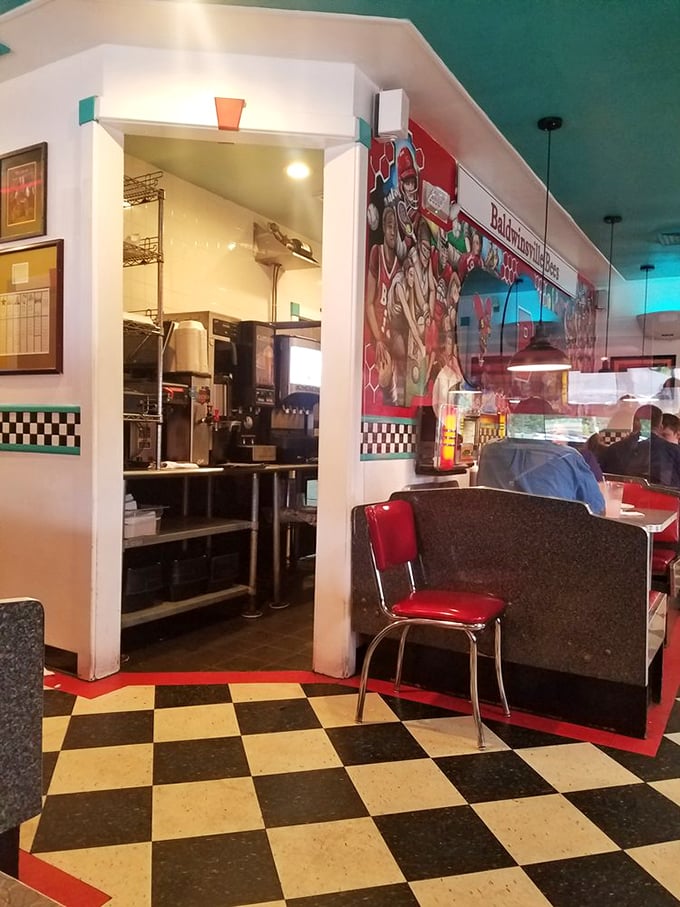 Peek-a-boo into the past! This kitchen view offers a glimpse of where the diner's timeless comfort food comes to life.