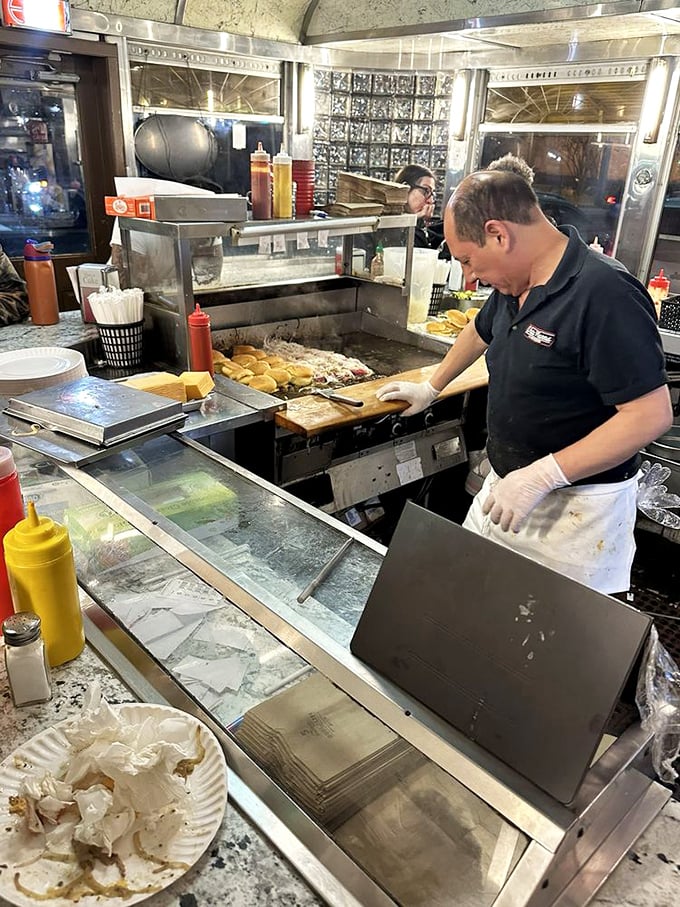Where the magic happens! Watch in awe as the grill masters perform their sizzling symphony, turning humble ingredients into slider gold.