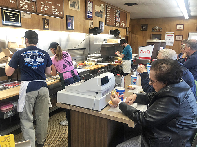 Burger magic in action! Watch as skilled hands transform simple ingredients into edible masterpieces right before your eyes.