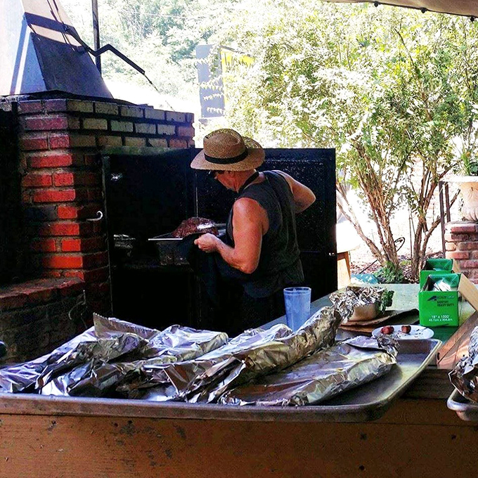 The wizard behind the curtain! Watch as the pitmaster works his magic, turning mere meat into BBQ gold.