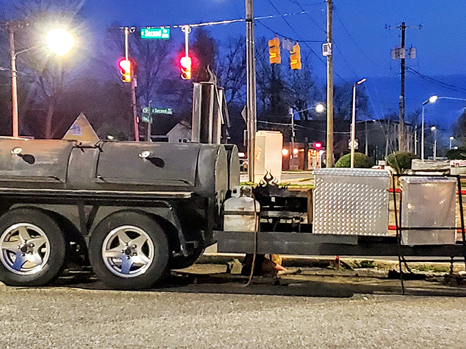 The secret weapon behind Ray's mouthwatering flavors! This outdoor griller's seen more action than a Hollywood stuntman, and it shows in every smoky bite.