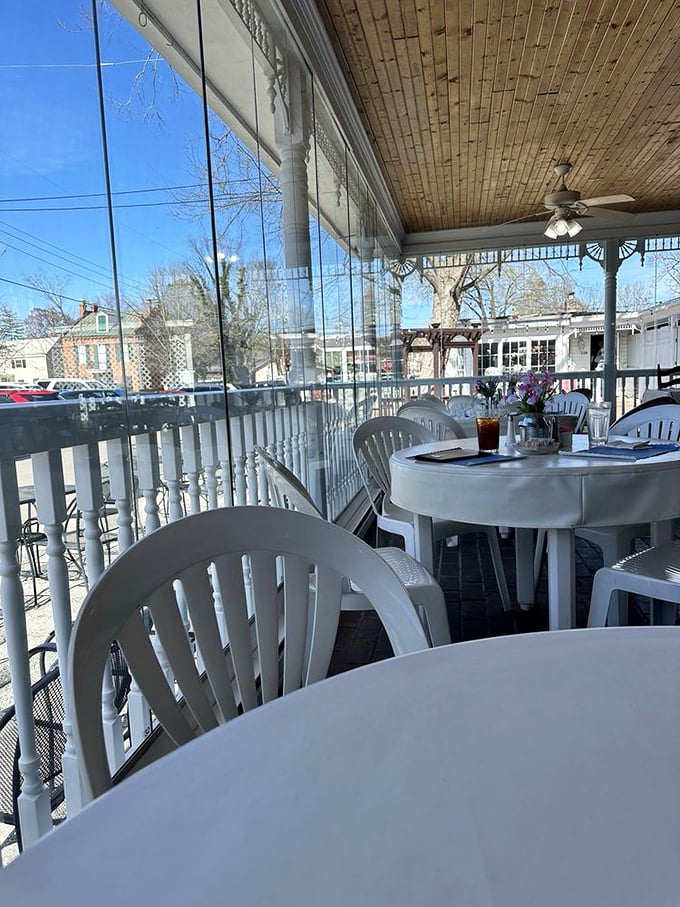 Enclosed porch seating where you can watch the world go by as you contemplate a second slice of pie.