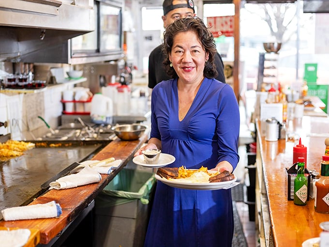 The maestro of morning meals! With a smile that bright, you know the food's going to be good.