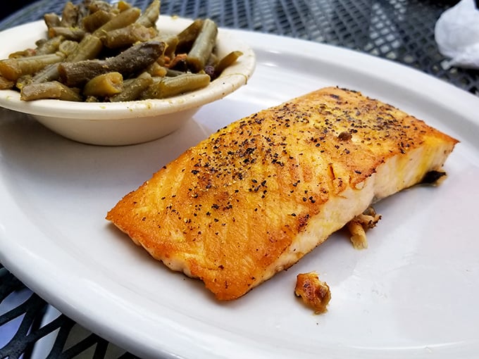 Salmon so perfectly cooked, it could make a grizzly bear consider switching to seafood. Those green beans ain't too shabby either!