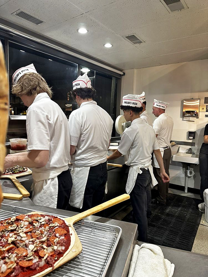 The pizza brigade, armed with paper hats and determination, ready to battle hunger one slice at a time.