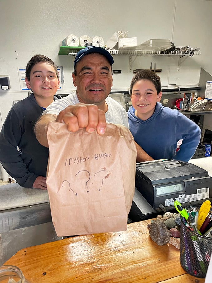 The secret ingredient? Smiles! This cheerful crew is serving up mystery burgers with a side of Alaskan hospitality.