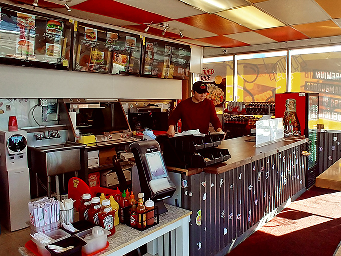 Behind every great burger is a great team. This staff member is ready to make your burger dreams a reality.