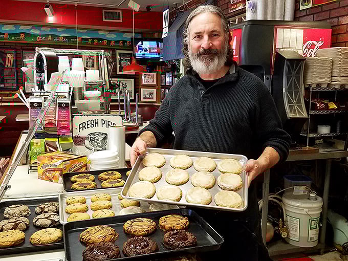 The cookie maestro! This friendly face is the wizard behind Ken's sweet treats. Flour-dusted apron: check. Warm smile: double-check.