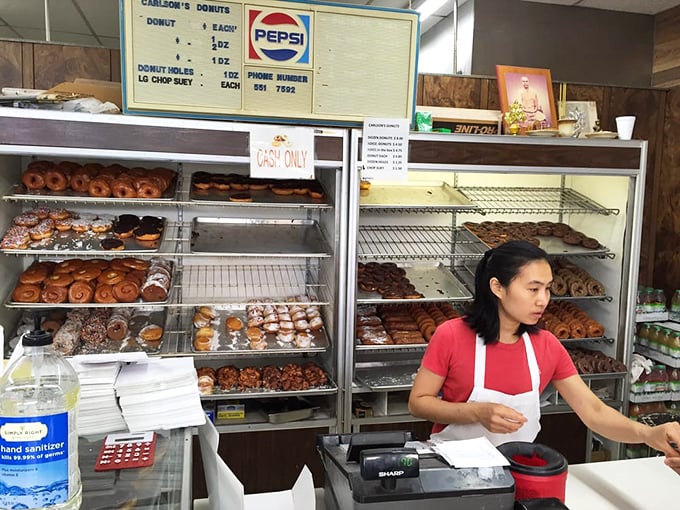 The wizards behind the curtain! These hardworking folks are the Willy Wonkas of the donut world, turning dough into dreams one batch at a time.