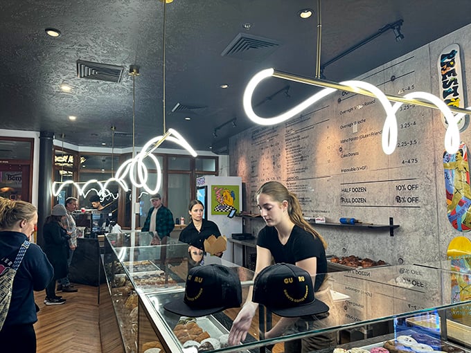 Behind the counter, donut wizards work their magic. These folks don't just make donuts; they craft edible works of art. Respect the process!