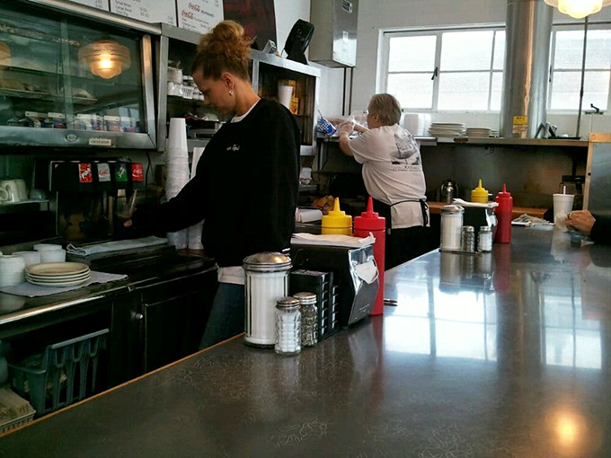 Behind the counter, culinary artists at work. Their canvas? Your plate. Their medium? Pure, unadulterated comfort food.