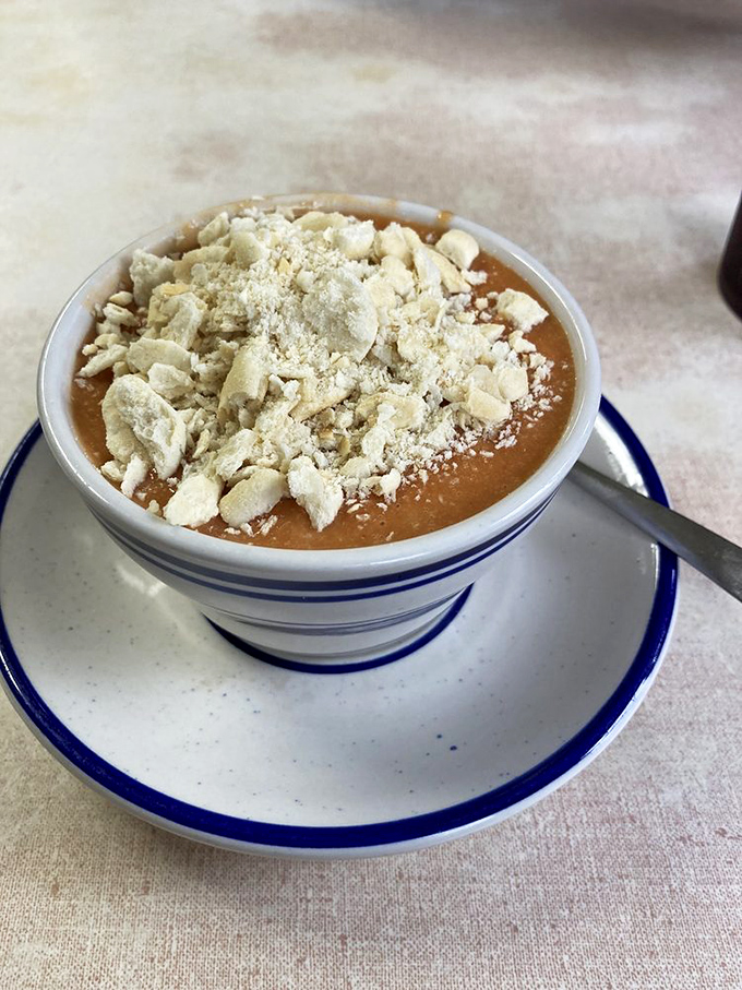 Tomato cheddar soup: comfort in a bowl. It's like a warm hug for your insides on a chilly Vermont day.