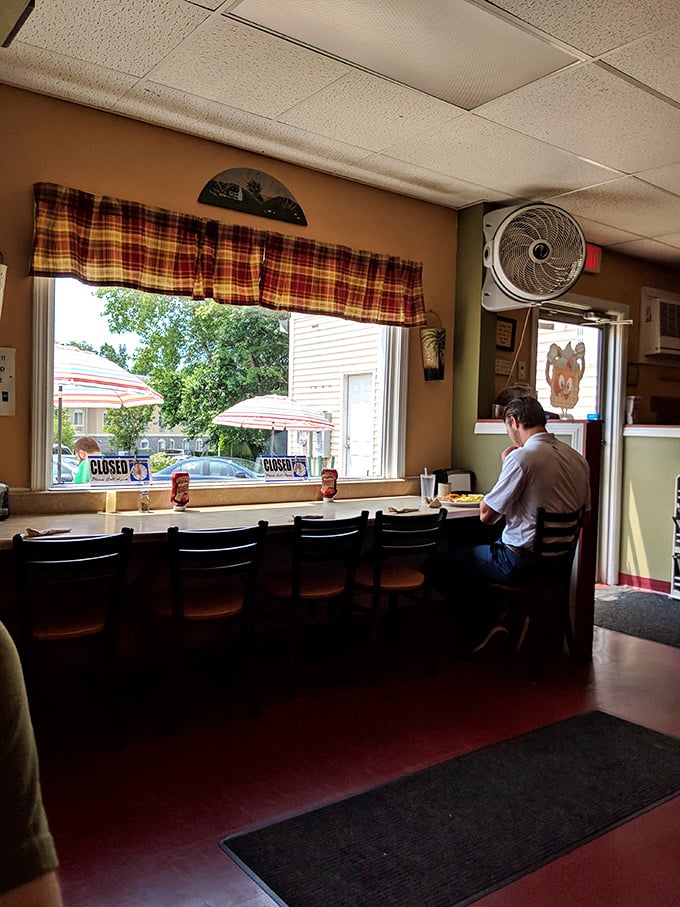 A window to waffle paradise. This cozy nook offers prime people-watching with a side of comfort food bliss.