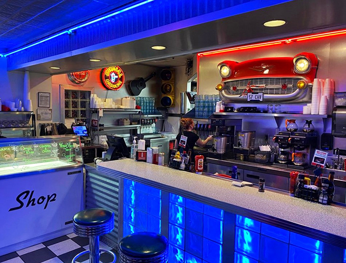 "Shake, rattle, and roll up to this bar! With its gleaming chrome and neon glow, it's the perfect spot for a malt and a memory."