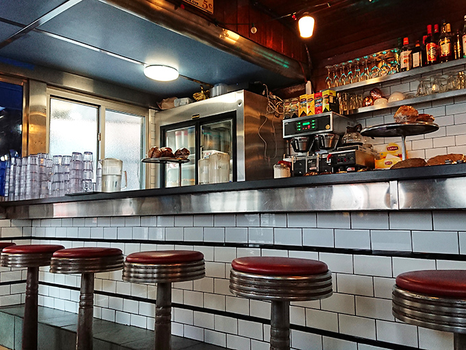 Pull up a stool to happiness. This classic diner counter is where coffee refills flow freely and the short-order cooks perform culinary magic before your eyes.