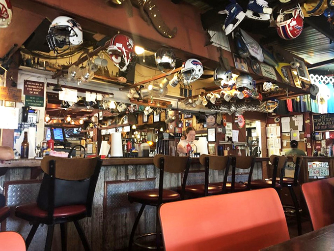 A bar where football helmets hang from the ceiling like trophies and every stool has supported decades of wing enthusiasts.