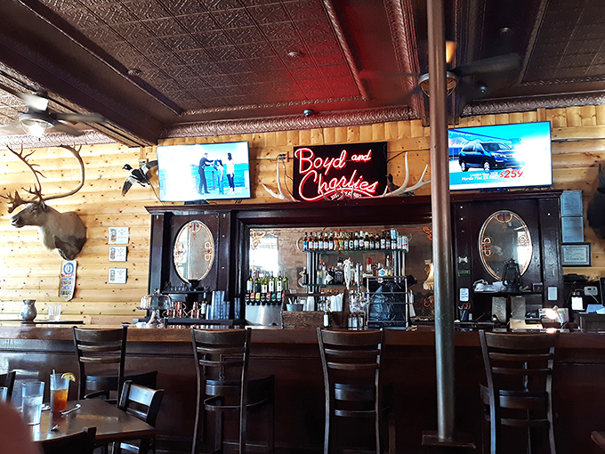 The bar's neon glow illuminates decades of BBQ tradition, where stories are shared and friendships forged over plates of smoky goodness.