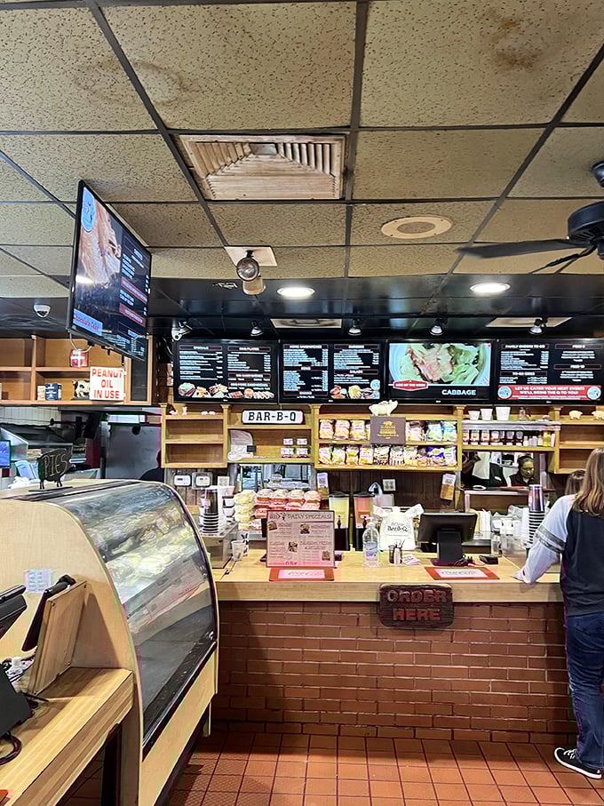 Order up! This counter is where BBQ dreams come true. Pro tip: Arrive hungry, leave happy (and possibly in need of elastic waistbands).