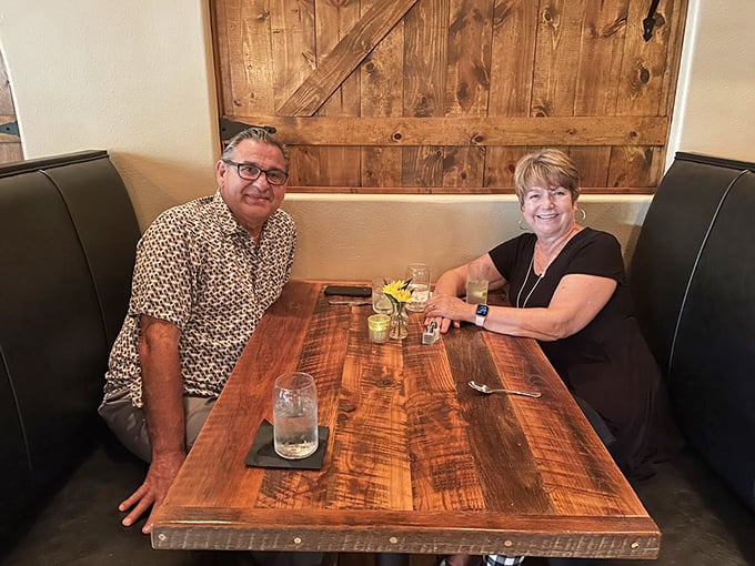 Cozy booth alert! The perfect spot for plotting world domination or just deciding on dessert.