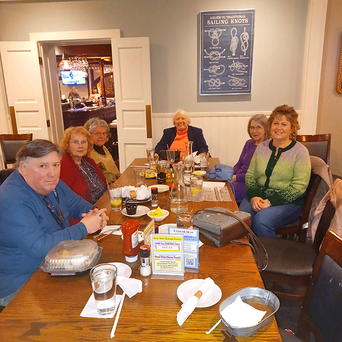 Happy faces around the table &ndash; the universal sign of good eats! These folks look like they've found their own personal seafood paradise.