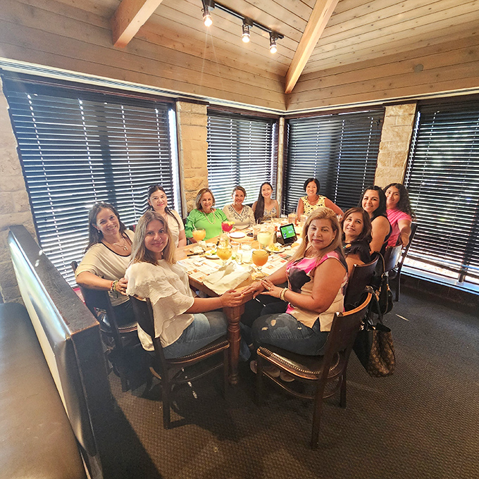 Good food is best when shared with friends. This corner table has become command central for what appears to be a joyful gathering.
