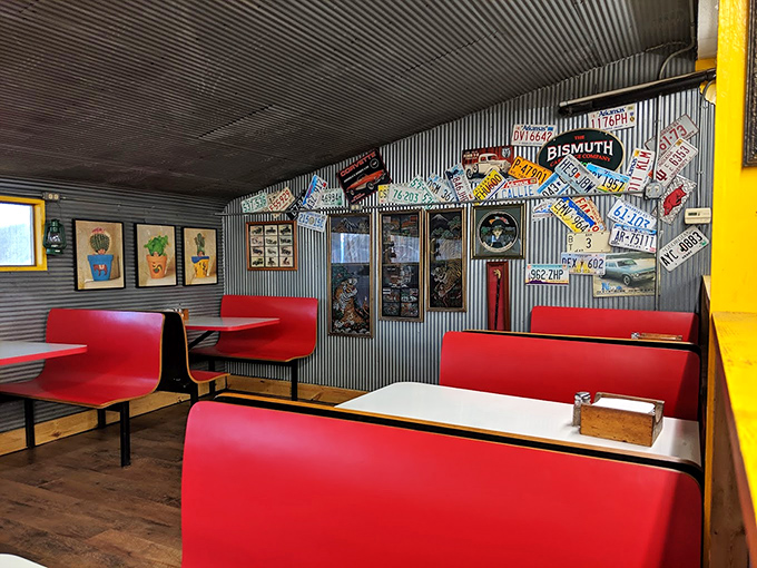 Red booths against corrugated metal walls lined with license plates&mdash;it's like sitting inside a time capsule where calories don't count and conversations flow freely.