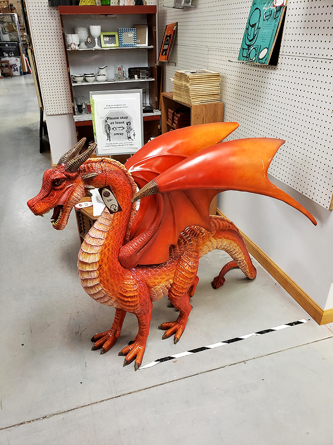 Here be dragons! This fiery figurine is ready to guard your hoard of vintage treasures or just add a touch of fantasy to your bookshelf.