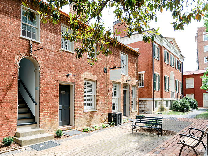 Brick, benches, and Southern charm. This historic building whispers tales of the past while offering modern comforts.