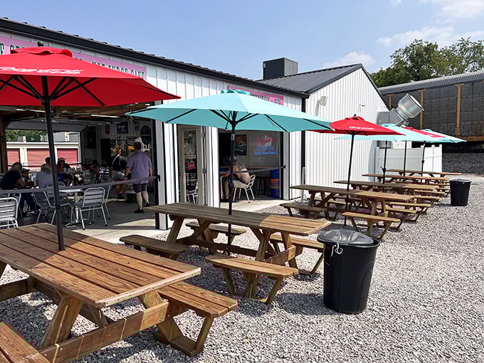 Outdoor dining at its finest. With colorful umbrellas and rustic picnic tables, it's like a Norman Rockwell painting come to life – but with better food.