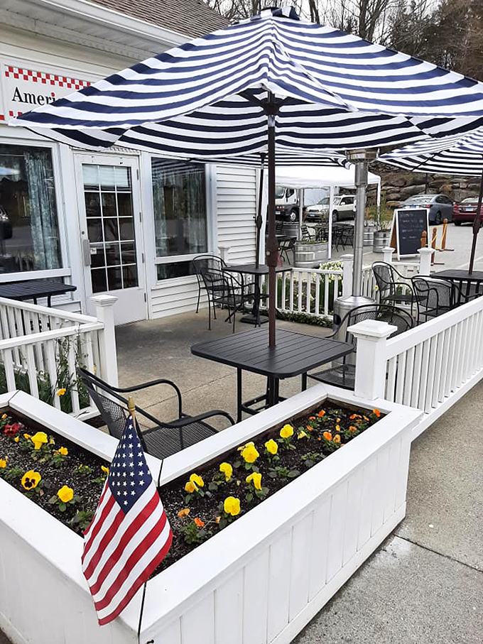Alfresco dining at its finest. This charming outdoor area, complete with striped umbrellas and blooming flowers, is perfect for people-watching and pie-eating.
