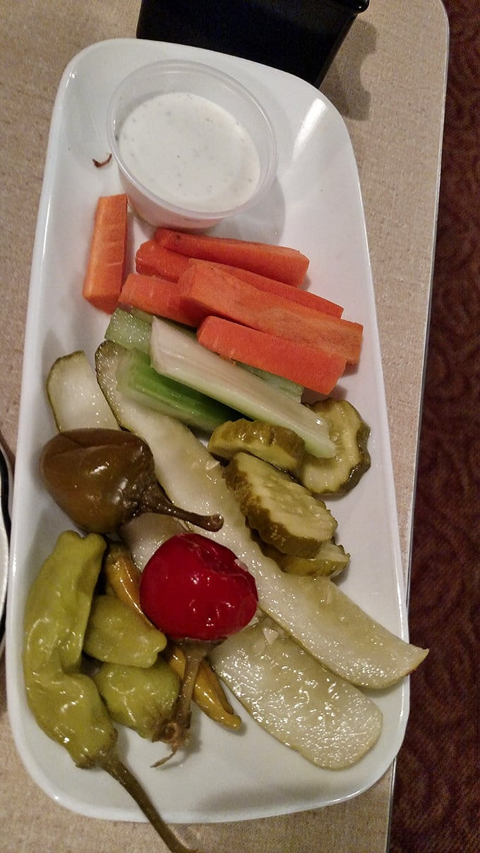 The relish tray: a rainbow of crunchy delights. It's like nature's candy store, but with more pickles and less guilt.