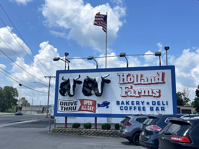 Moo-ve over, ordinary bakeries! This sign promises a dairy good time with fresh treats that'll make you cream with joy. It's udderly delightful!