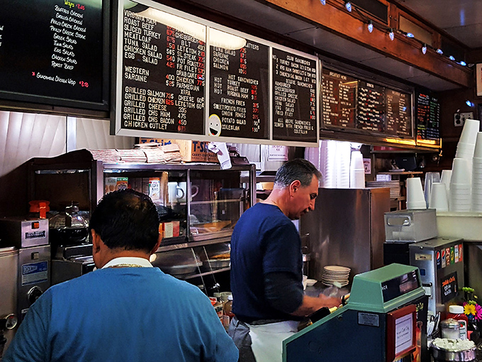 The unsung heroes of your meal! These hardworking staff members are the secret ingredient in every perfectly flipped pancake and crispy hash brown.