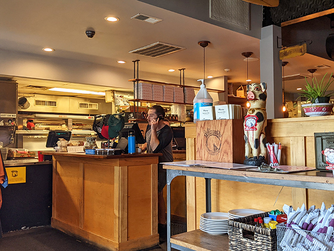 The pizza whisperer at work. Dr. Ho's staff crafts each pie with the precision of a surgeon and the passion of an artist.