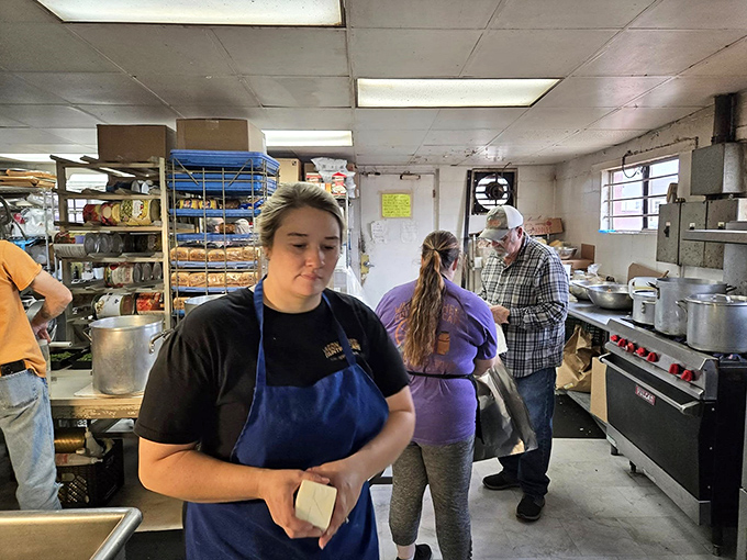 Behind the scenes at flavor central. These culinary wizards work their magic in a kitchen that's seen more action than a soap opera marathon.
