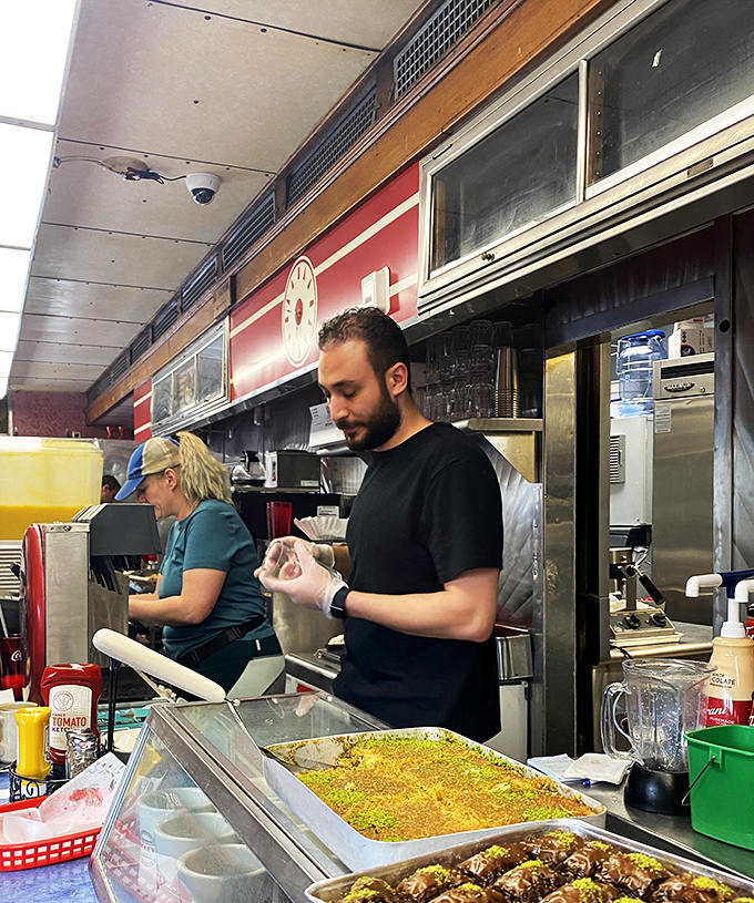 The unsung heroes of happiness. Mickey's staff work their magic, turning simple ingredients into plates of joy.
