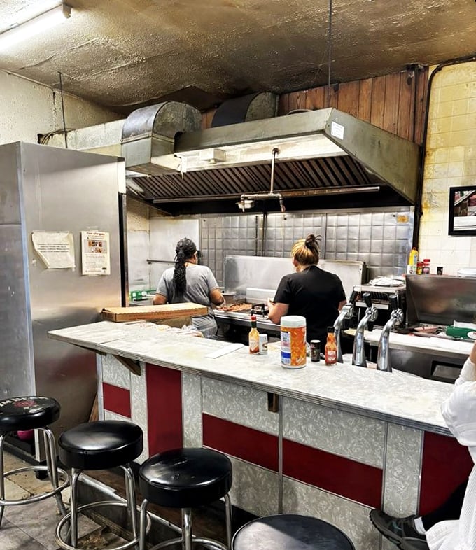 The wizards of the grill, hard at work. These culinary maestros are the unsung heroes behind every delicious bite.
