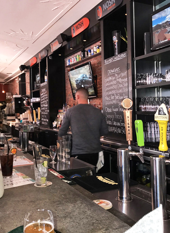 Behind the magic! Nosh's dedicated staff work their culinary wizardry, turning simple ingredients into pure deliciousness before your eyes.