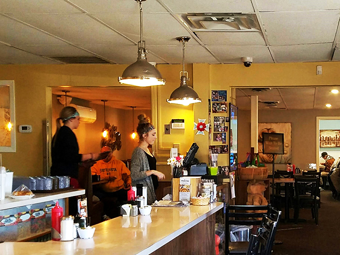 Behind the counter, where the magic happens. These culinary wizards are ready to turn your hunger into happiness faster than you can say "pie &agrave; la mode."