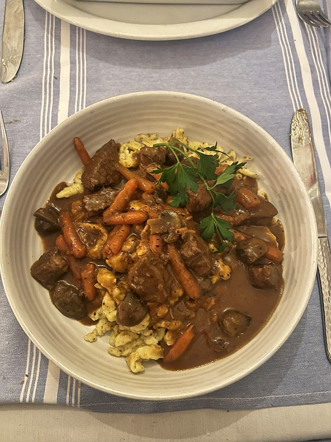 Beef Bourguignon: where tender meat swims in a wine sauce so rich, it probably has its own offshore account.