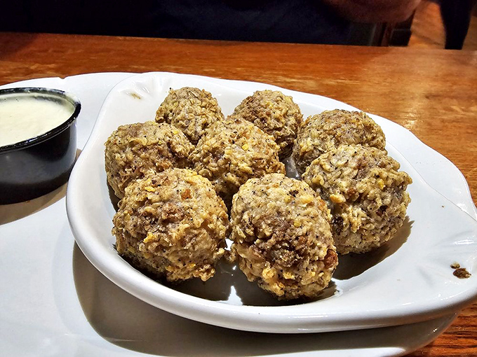 Boudin balls: Cajun cuisine's answer to the question, "What if we made sausage even more fun?" Crispy, savory, and utterly addictive.