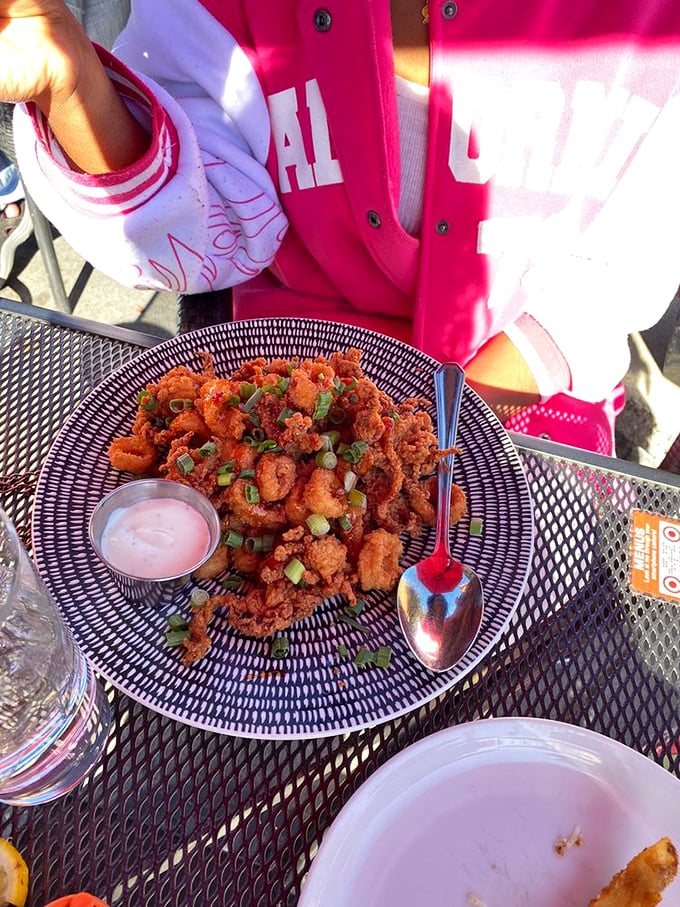 Crispy calamari with a vibrant sauce&mdash;seafood that's taken a delicious detour from the ocean to this perfect purple plate.