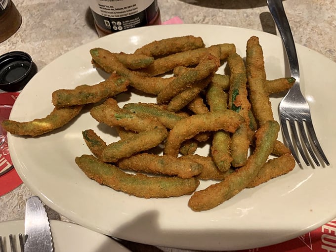 Green beans got a crispy makeover! These golden-fried veggies are the ultimate wingmen for your pizza adventure.