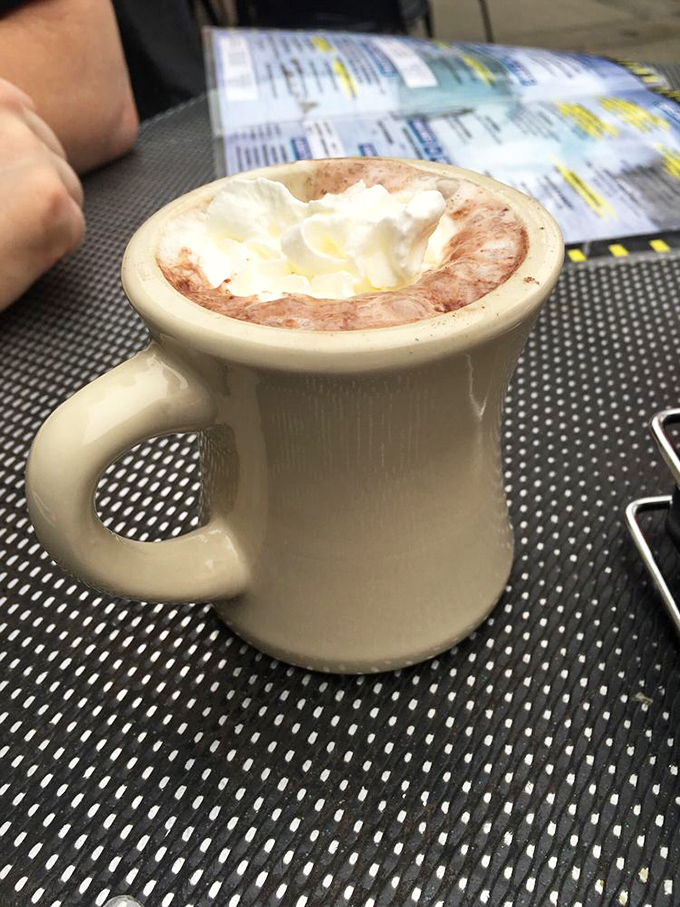 Hot chocolate that hugs you back! This creamy concoction is topped with a marshmallow hat so fluffy, it's practically wearing a beret.