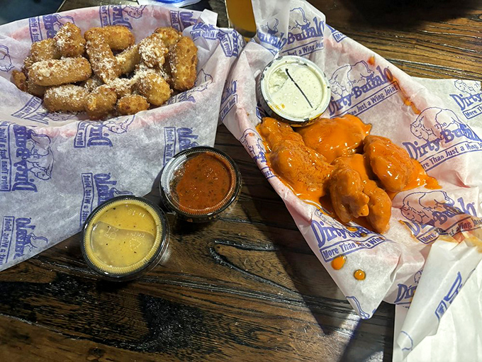 A study in contrasts: mild wings for the cautious, garlic parmesan bites for the adventurous, and dipping sauces for the indecisive. Democracy in action.