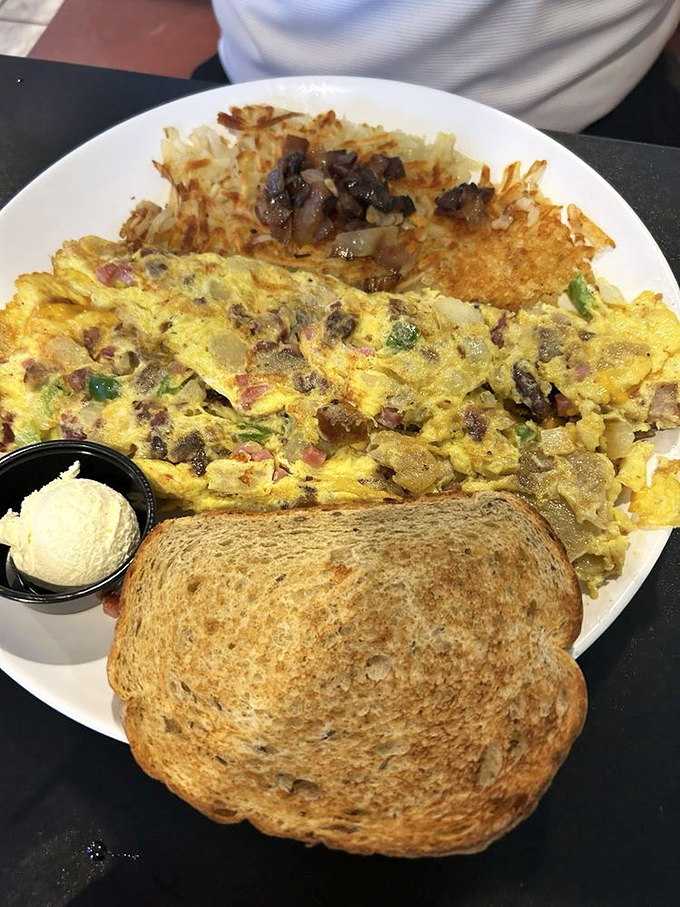 This omelet is so packed, it could apply for its own zip code. It's a flavor fiesta wrapped in an egg blanket!