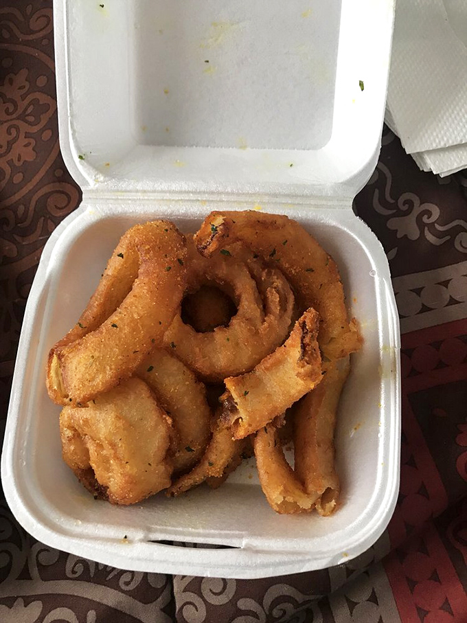 Crispy, golden onion rings that shatter with each bite&mdash;the unsung heroes of the Ching's side dish lineup.