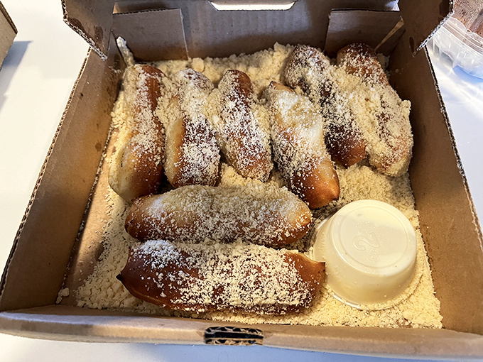 Parmesan breadsticks: the unsung heroes of the pizza universe, dusted with cosmic cheese particles.